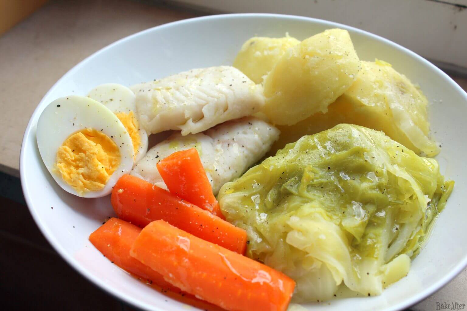 Boiled Hake with Cabbage Carrots Potatoes and Eggs · Bake After Recipe